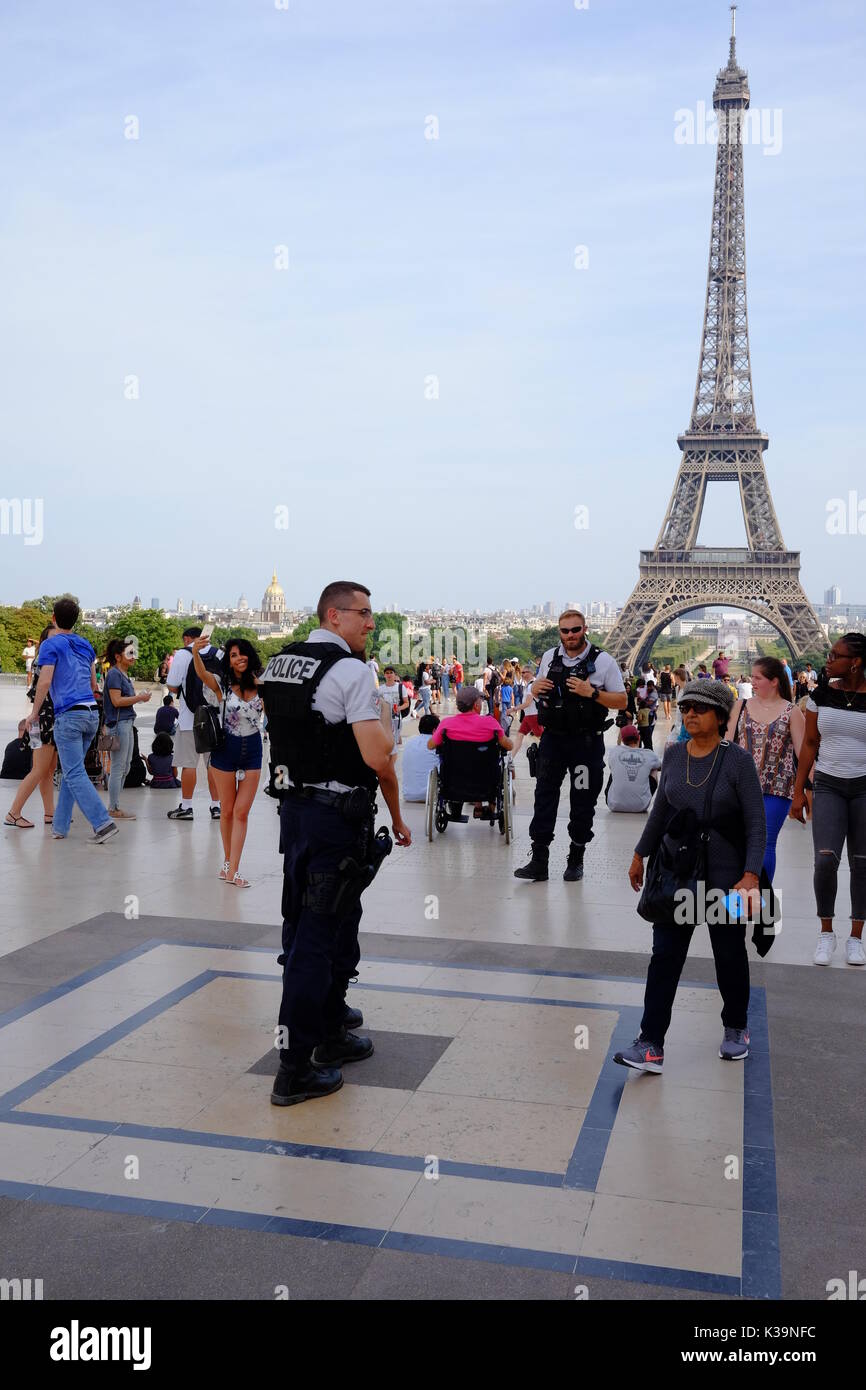 Armed French police patrol the streets of Paris and the Eiffel Tower in ...