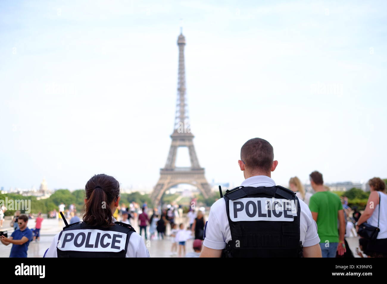 Armed French police patrol the streets of Paris and the Eiffel Tower in ...