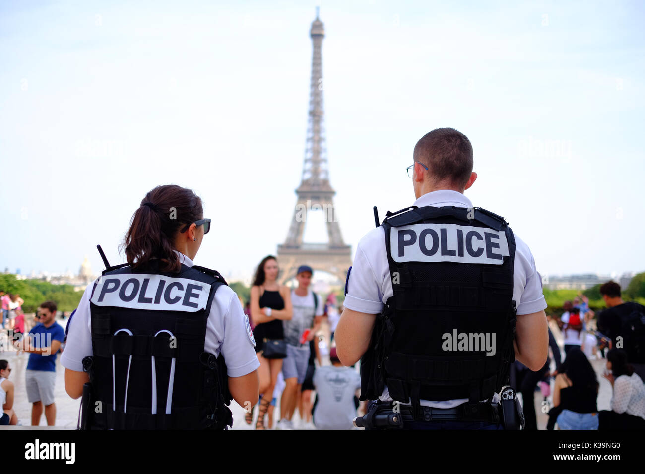 Armed French police patrol the streets of Paris and the Eiffel Tower in ...