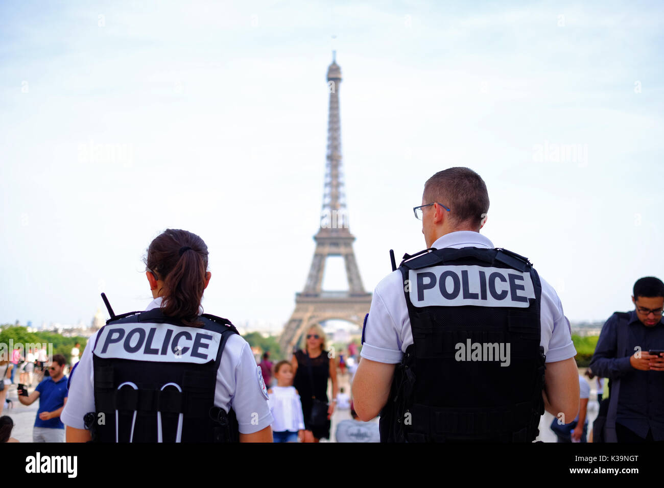 Armed French police patrol the streets of Paris and the Eiffel Tower in ...