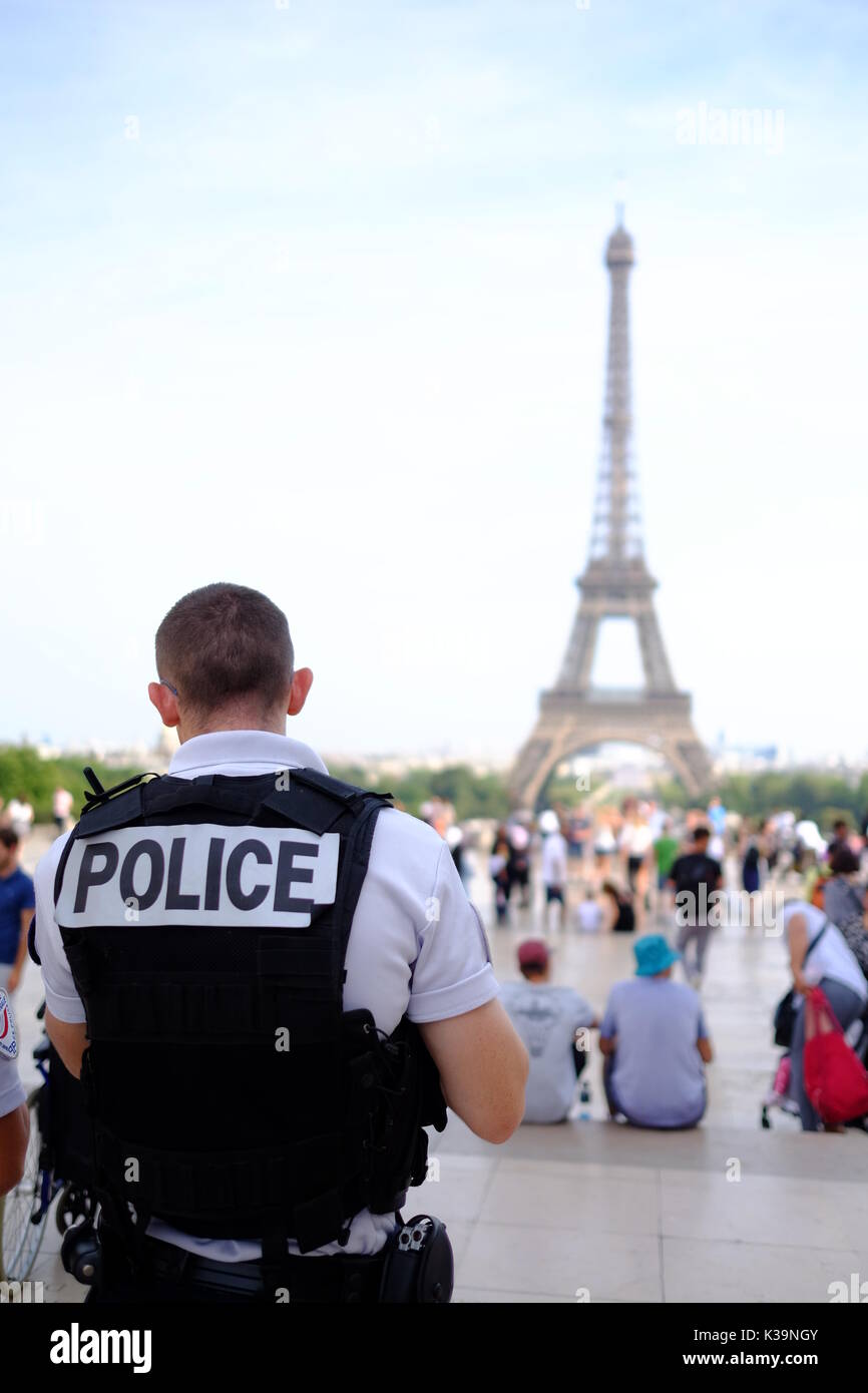 Armed French police patrol the streets of Paris and the Eiffel Tower in ...