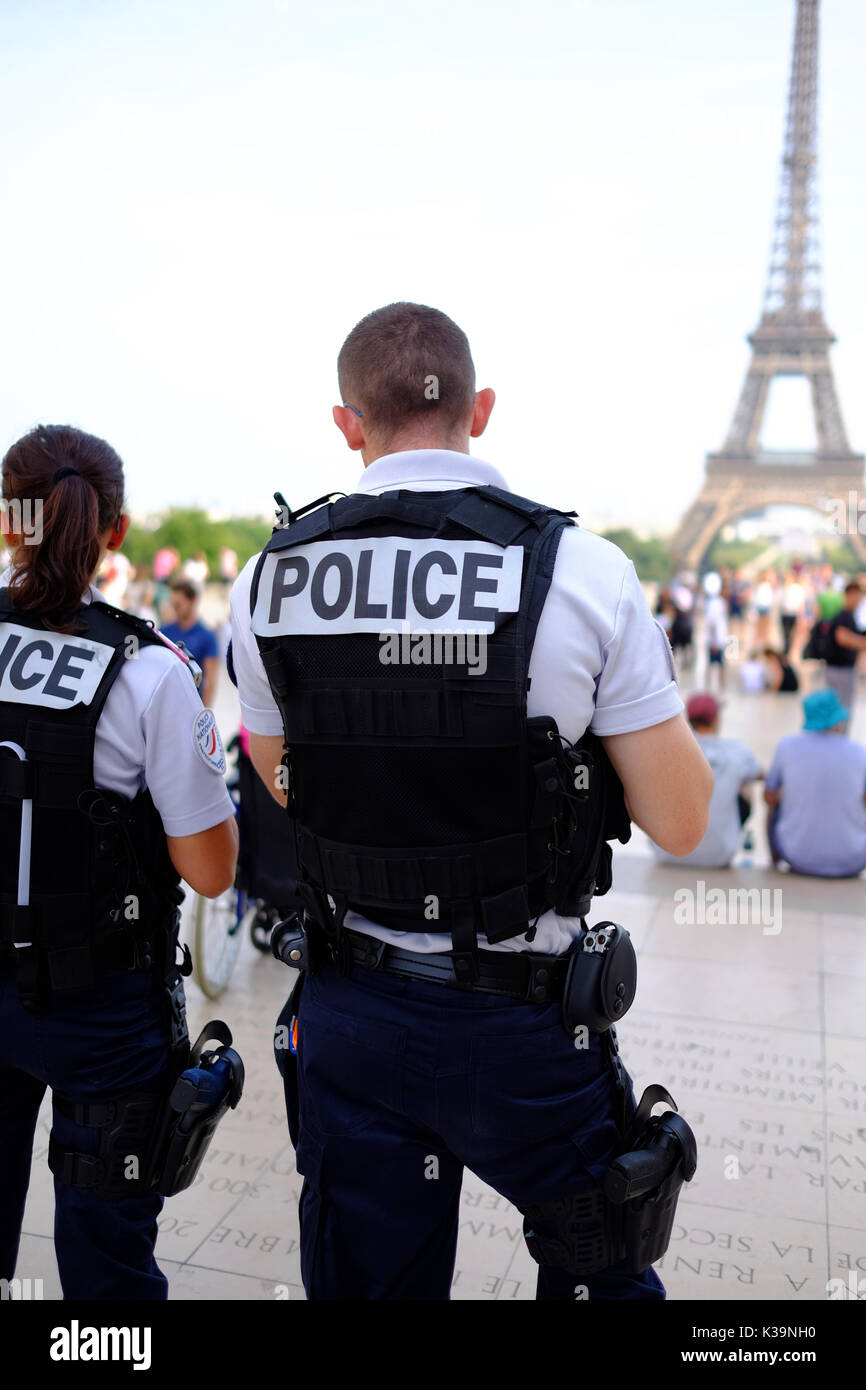 Armed French police patrol the streets of Paris and the Eiffel Tower in ...