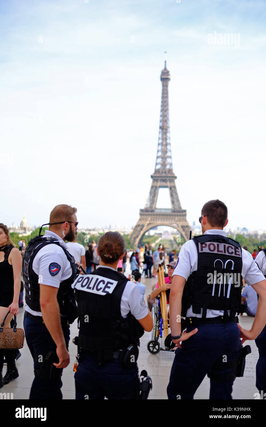 Armed French police patrol the streets of Paris and the Eiffel Tower in ...