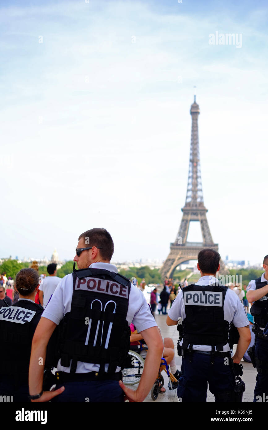 Armed French police patrol the streets of Paris and the Eiffel Tower in ...