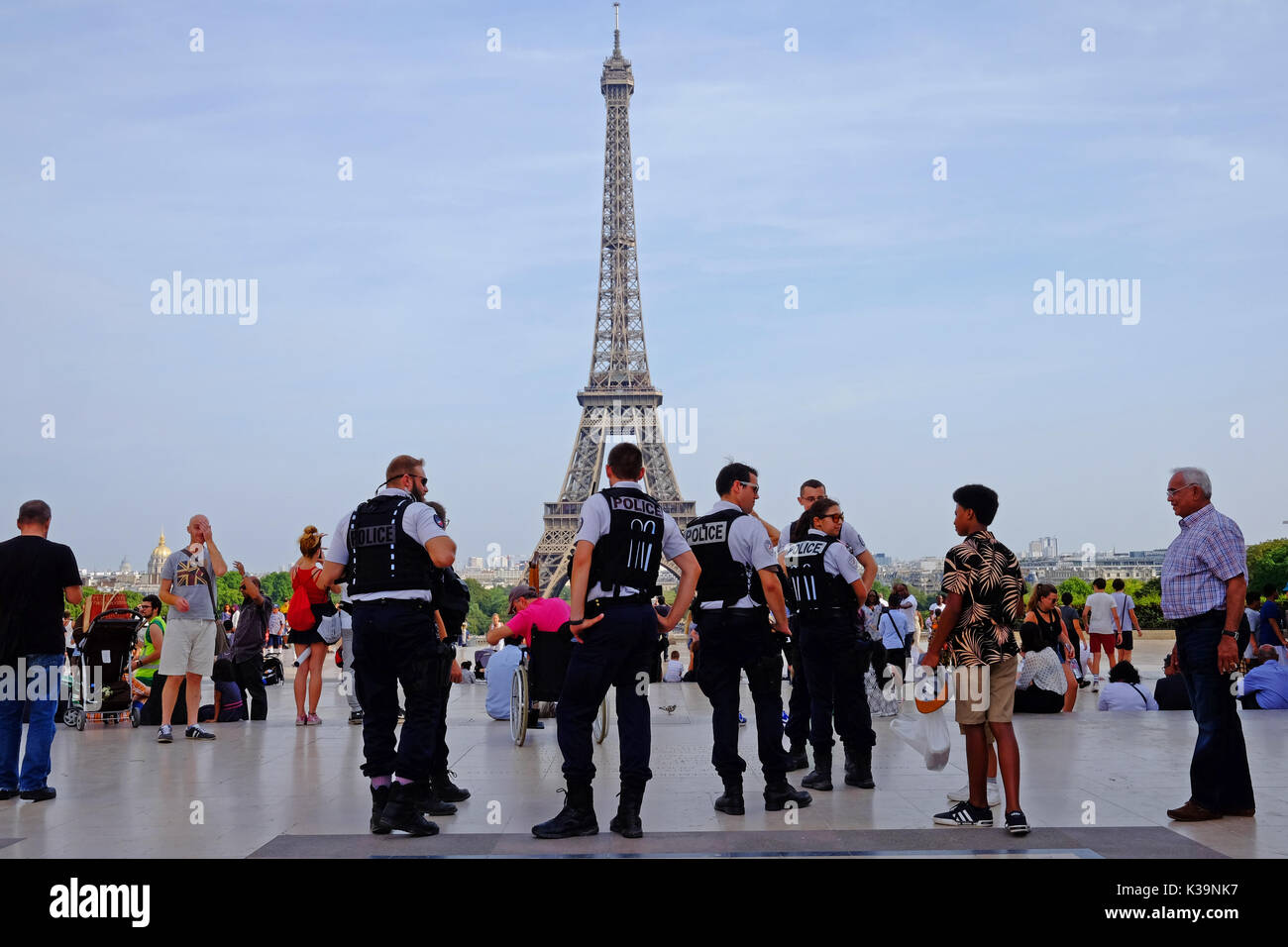 Armed French police patrol the streets of Paris and the Eiffel Tower in ...