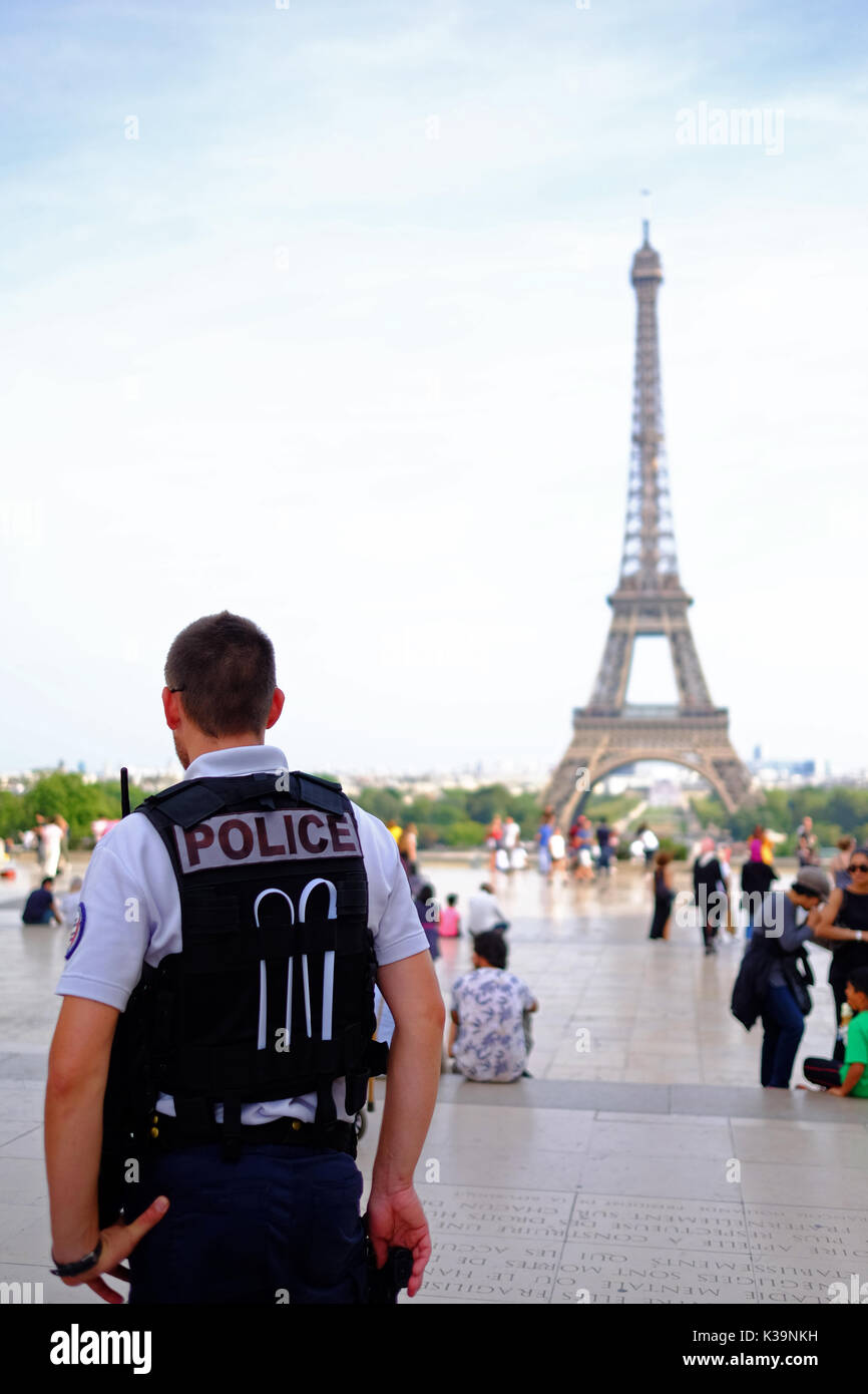 Armed French police patrol the streets of Paris and the Eiffel Tower in ...