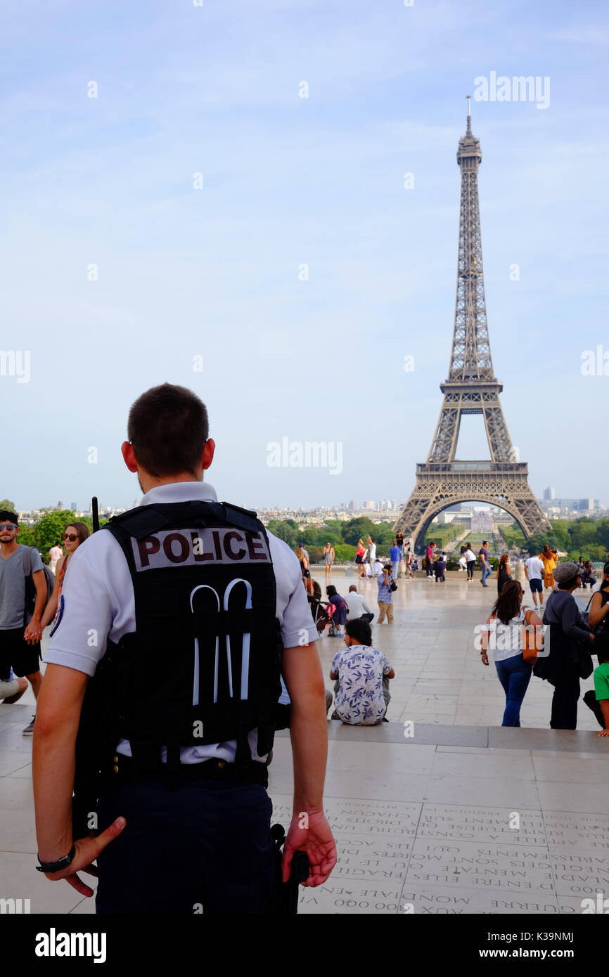 Armed French police patrol the streets of Paris and the Eiffel Tower in ...