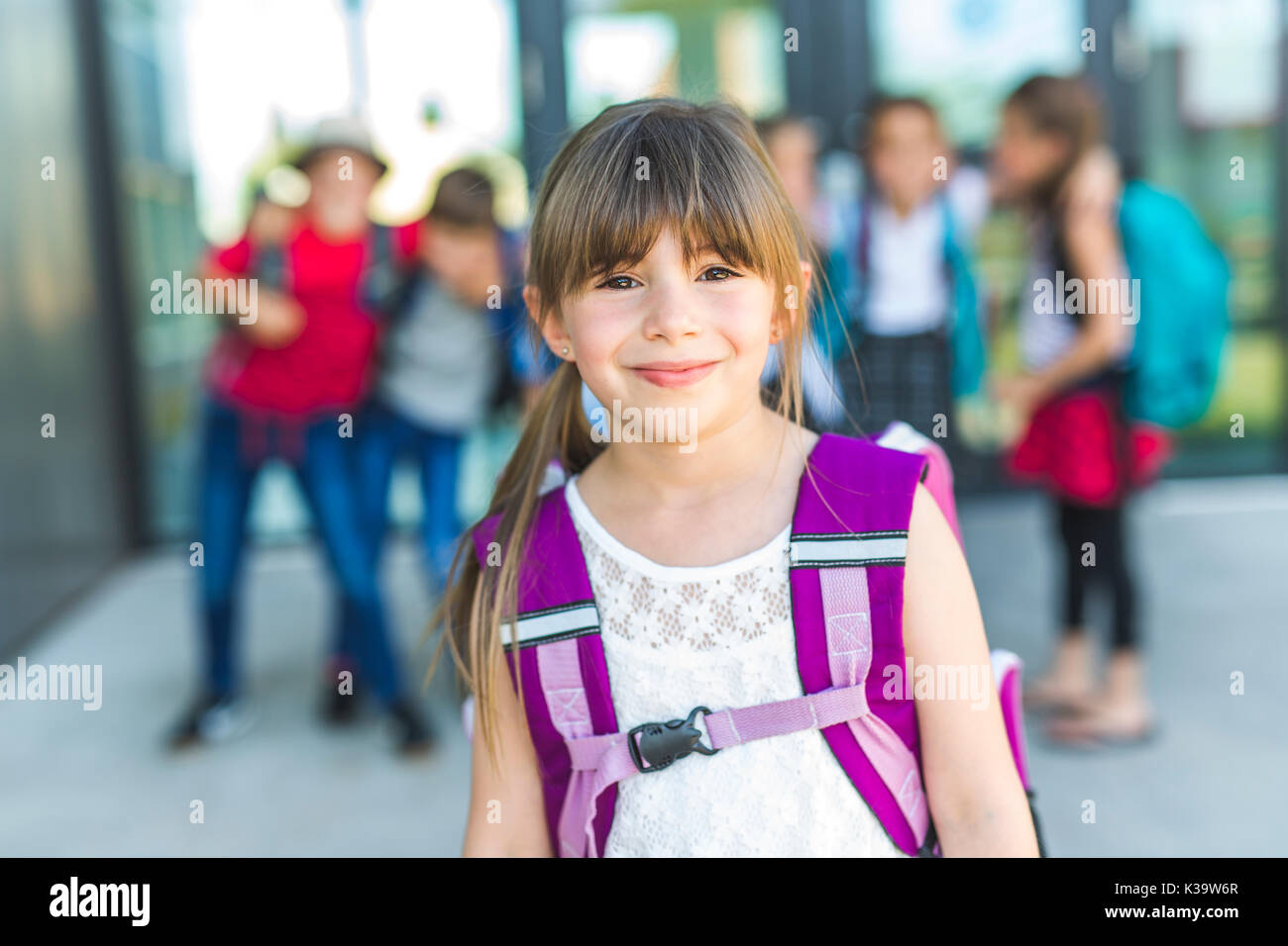 Portrait Of School Pupils Outside Classroom Carrying Bags Stock Photo ...