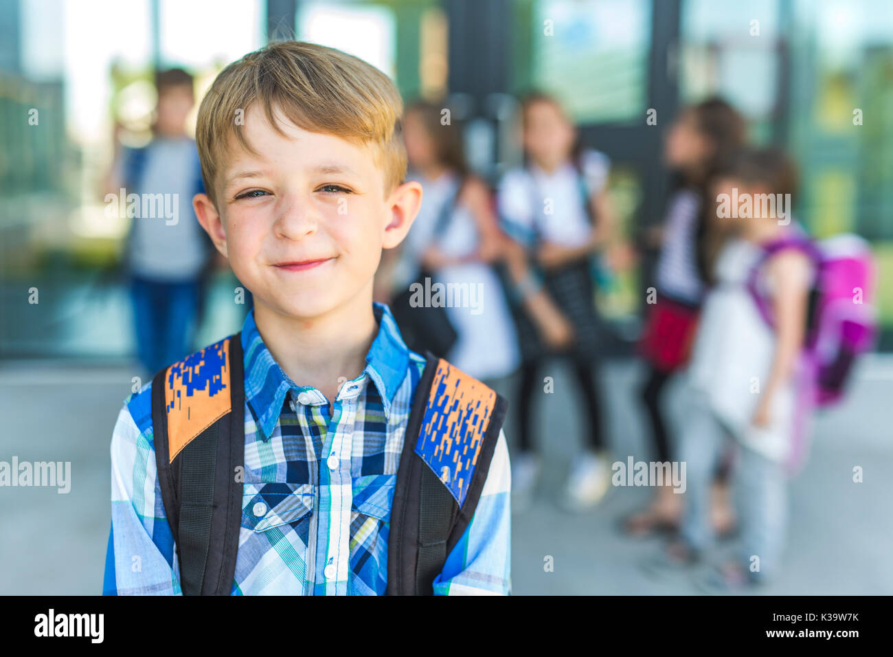 Portrait Of School Pupils Outside Classroom Carrying Bags Stock Photo ...