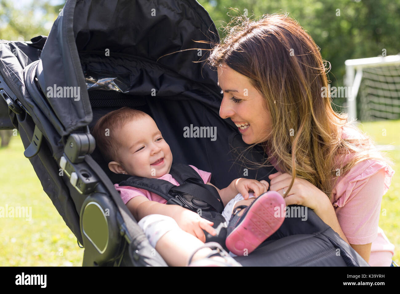 Girl pushing baby carriage hi-res stock photography and images - Alamy