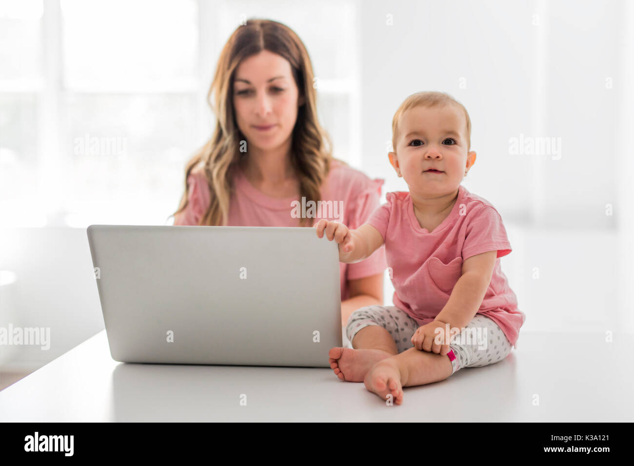 Woman baby computer hi-res stock photography and images - Alamy