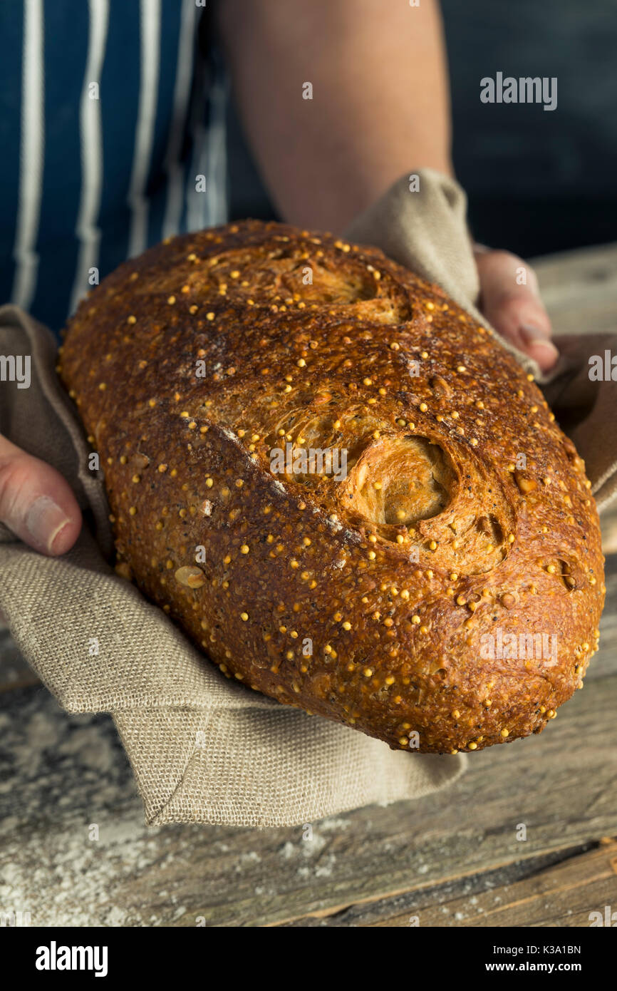 Handmade Organic Bread in a Womans Hands Ready to Eat Stock Photo - Alamy
