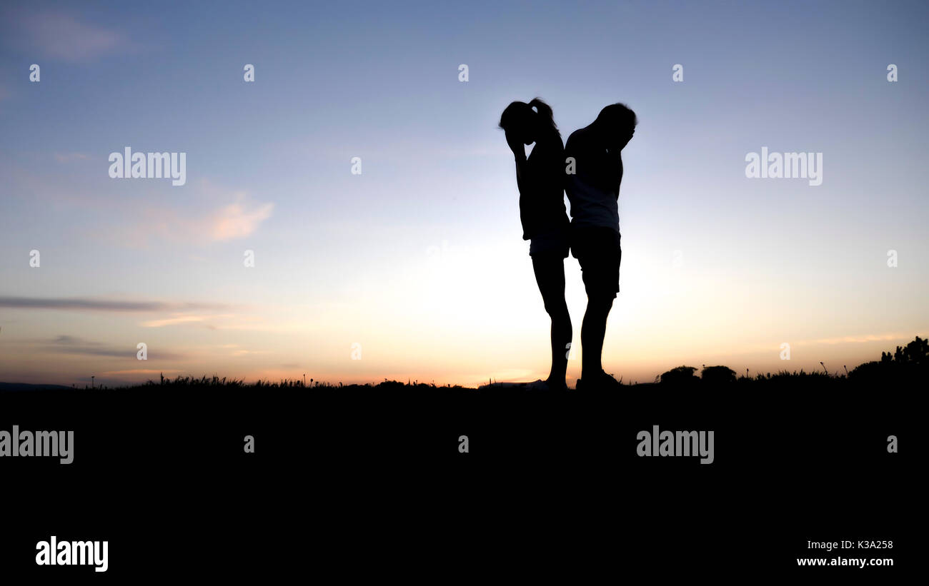 Couple silhouette breaking up a relation Stock Photo - Alamy