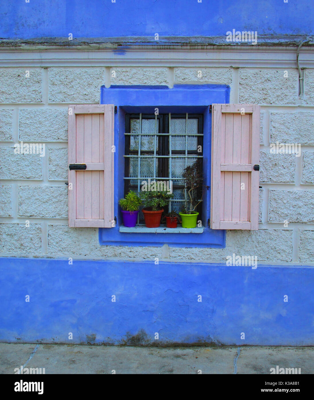 The windows of the white and blue house on the hill (2 Stock Photo - Alamy