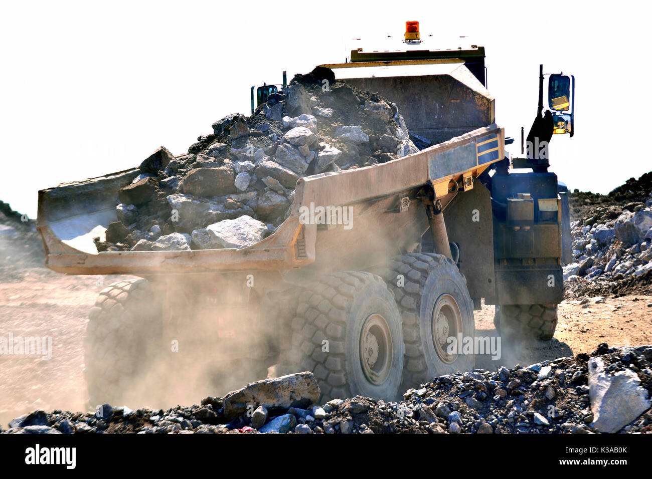 heavy construction dumper at work In the dust Stock Photo - Alamy