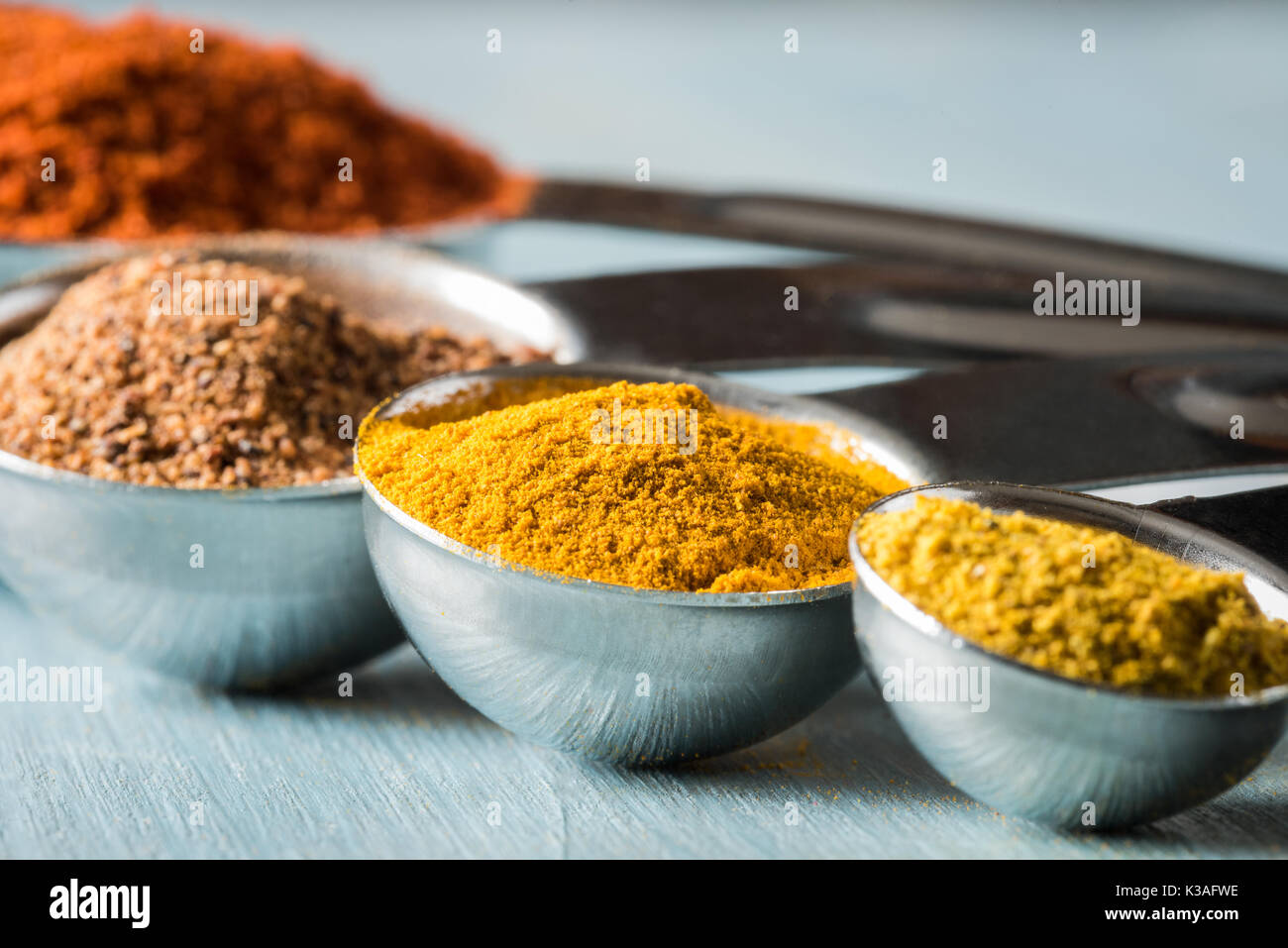 Spices in Measuring Spoons Stock Photo - Alamy