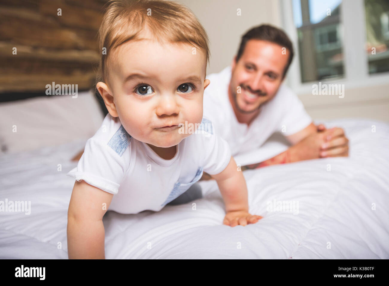 Portrait of a father with her nine months old baby Stock Photo - Alamy