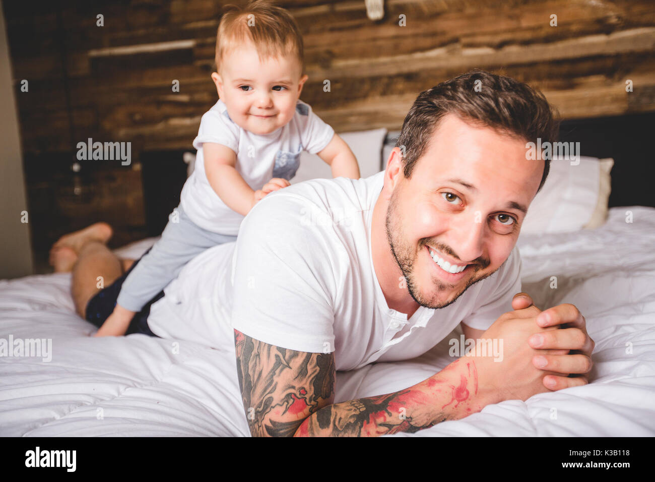 Portrait of a father with her nine months old baby Stock Photo - Alamy