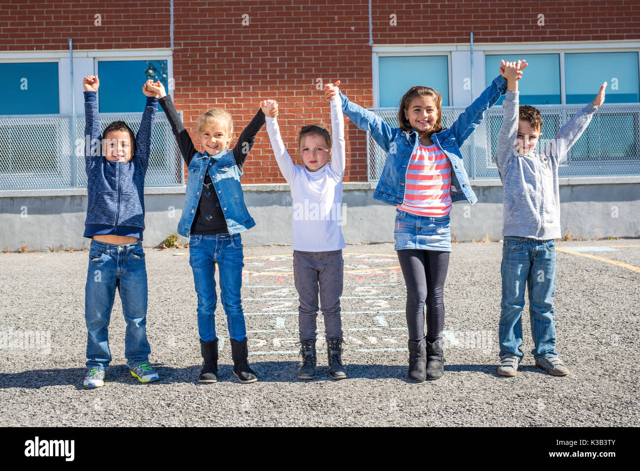 students outside school standing together Stock Photo - Alamy
