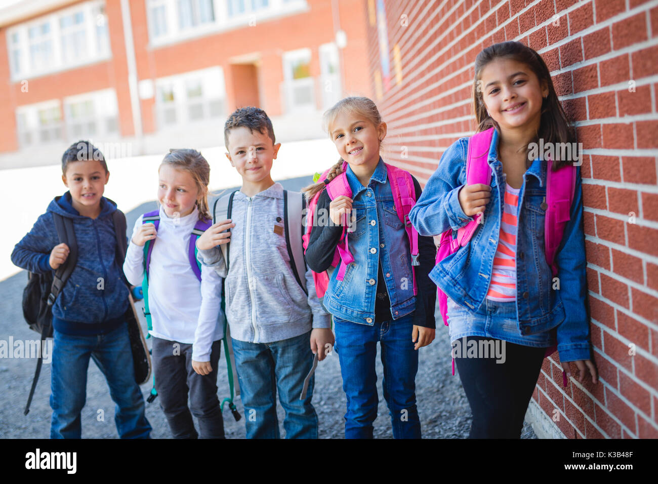 students outside school standing together Stock Photo - Alamy