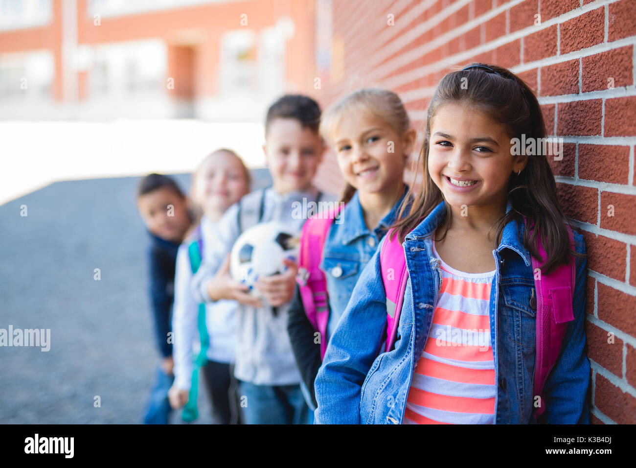 students outside school standing together Stock Photo - Alamy
