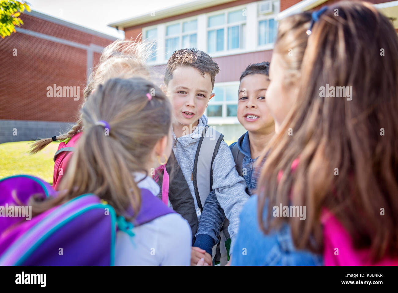 students outside school standing together Stock Photo - Alamy
