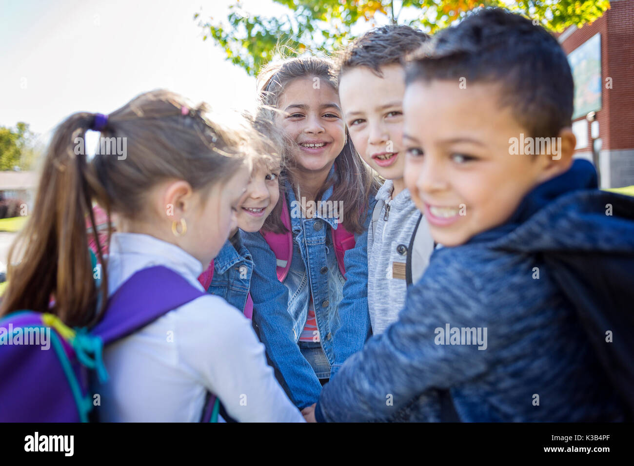 students outside school standing together Stock Photo - Alamy