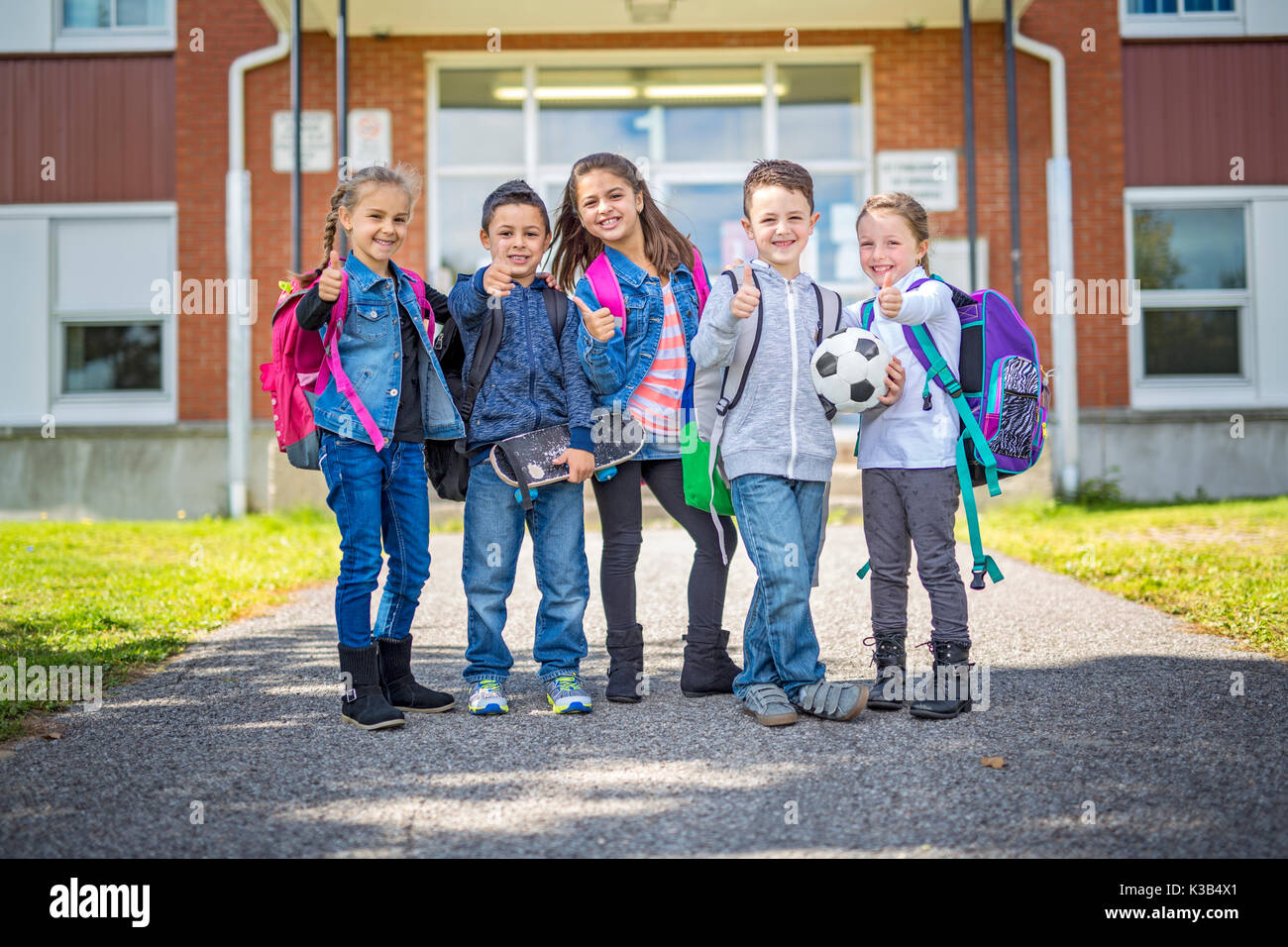 students outside school standing together Stock Photo - Alamy