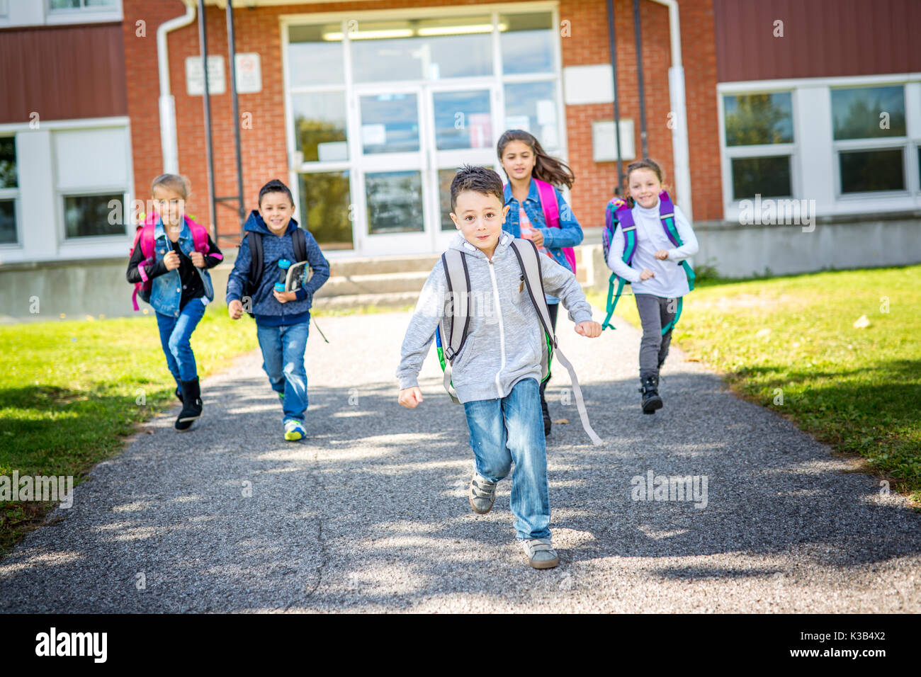 students outside school standing together Stock Photo - Alamy