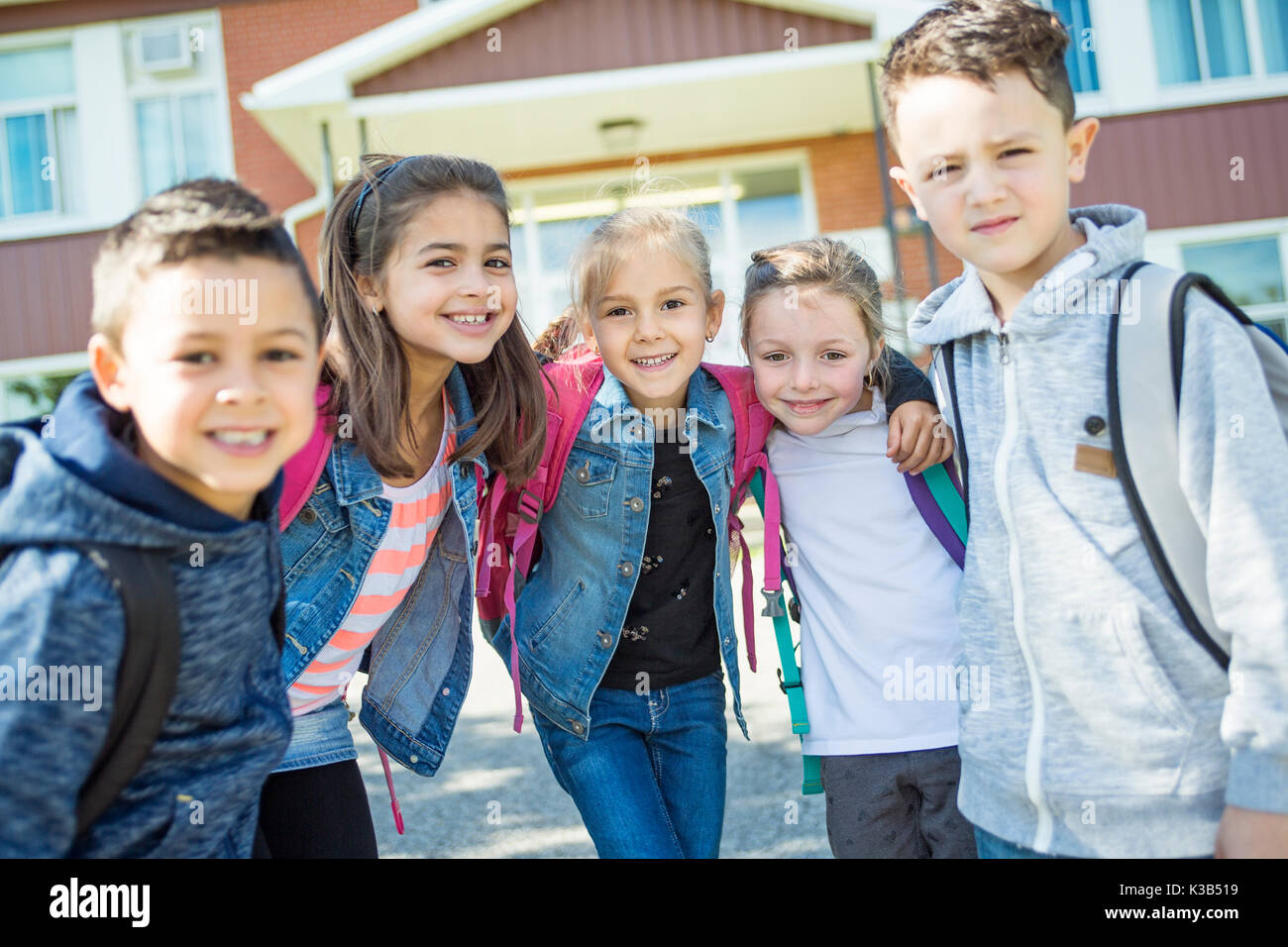 students outside school standing together Stock Photo - Alamy