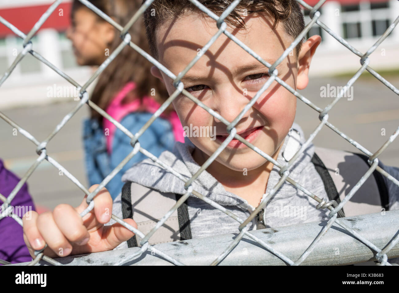 student outside school standing smiling Stock Photo - Alamy