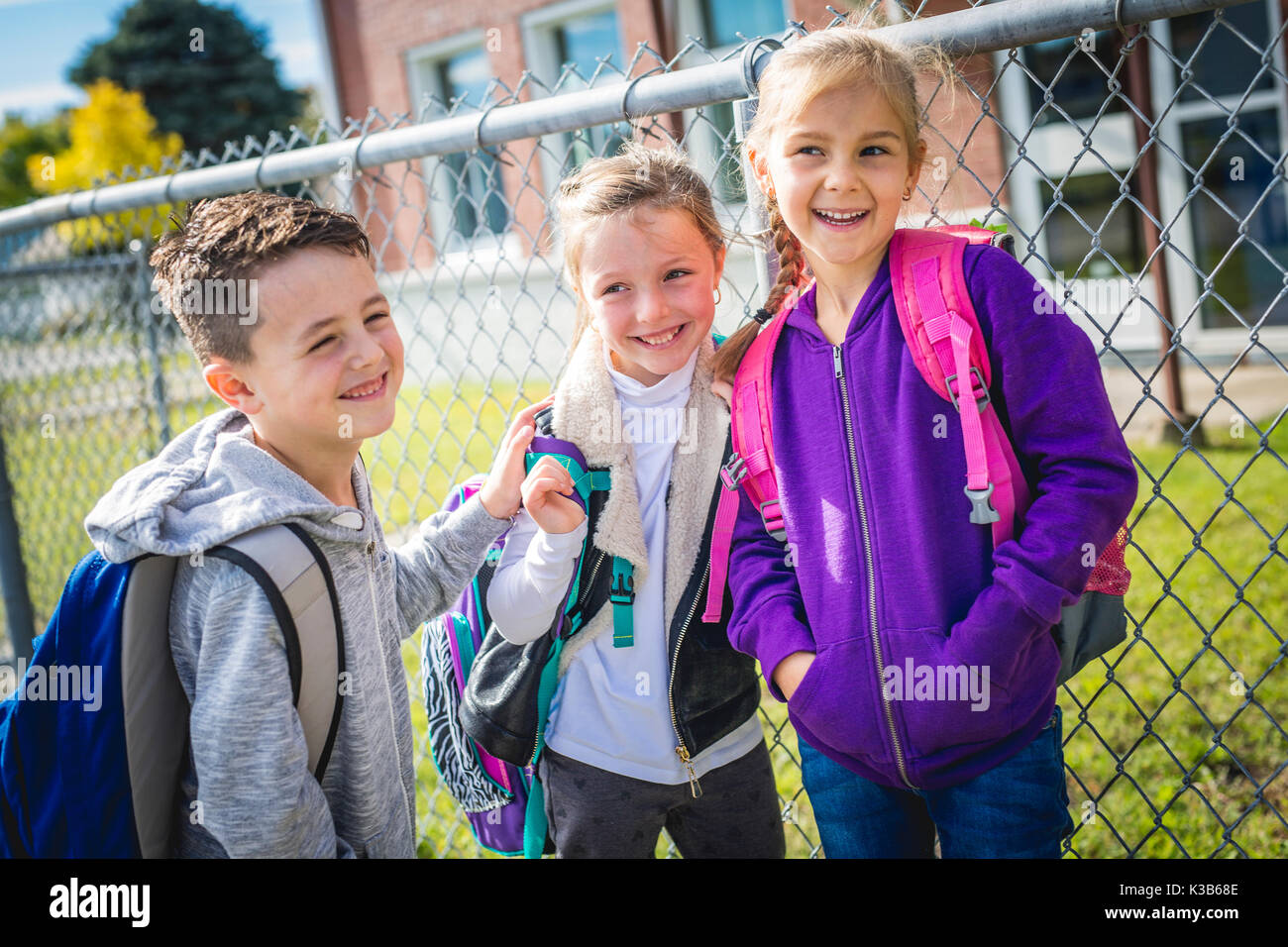 students outside school standing together Stock Photo - Alamy
