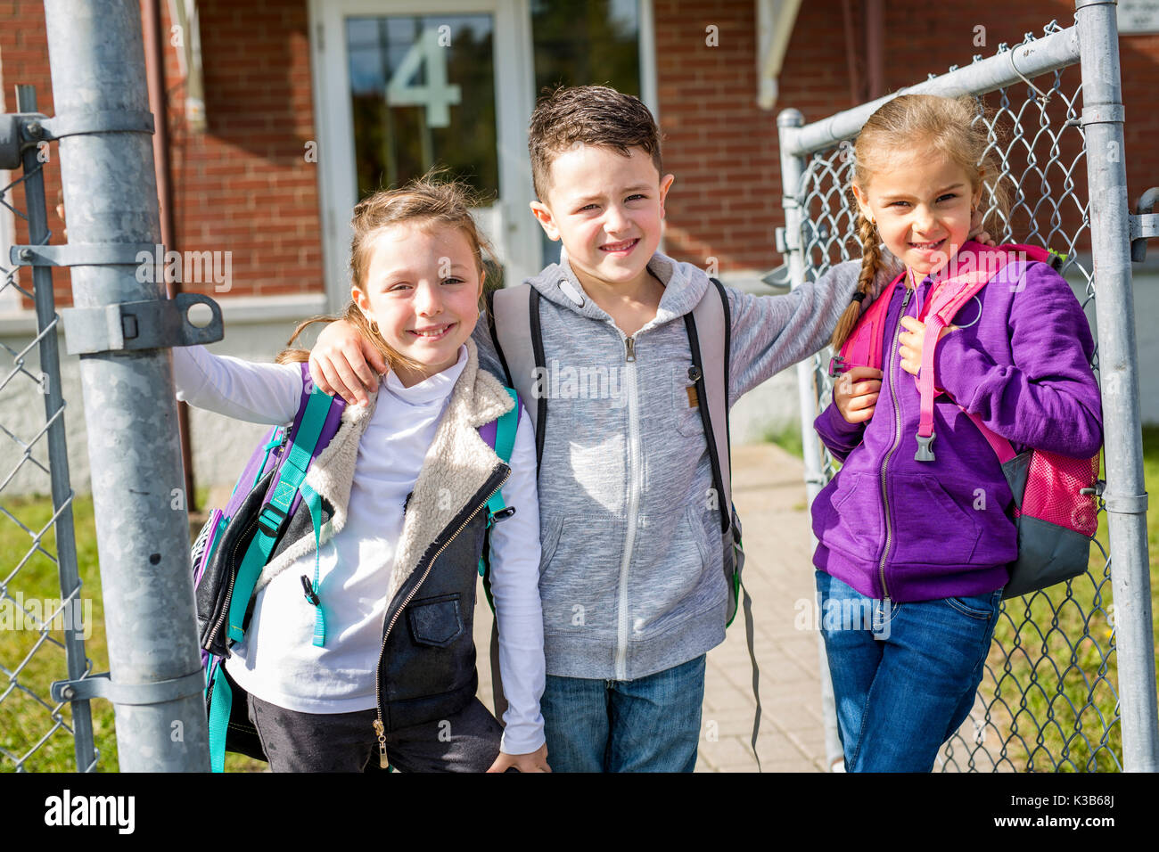 students outside school standing together Stock Photo - Alamy