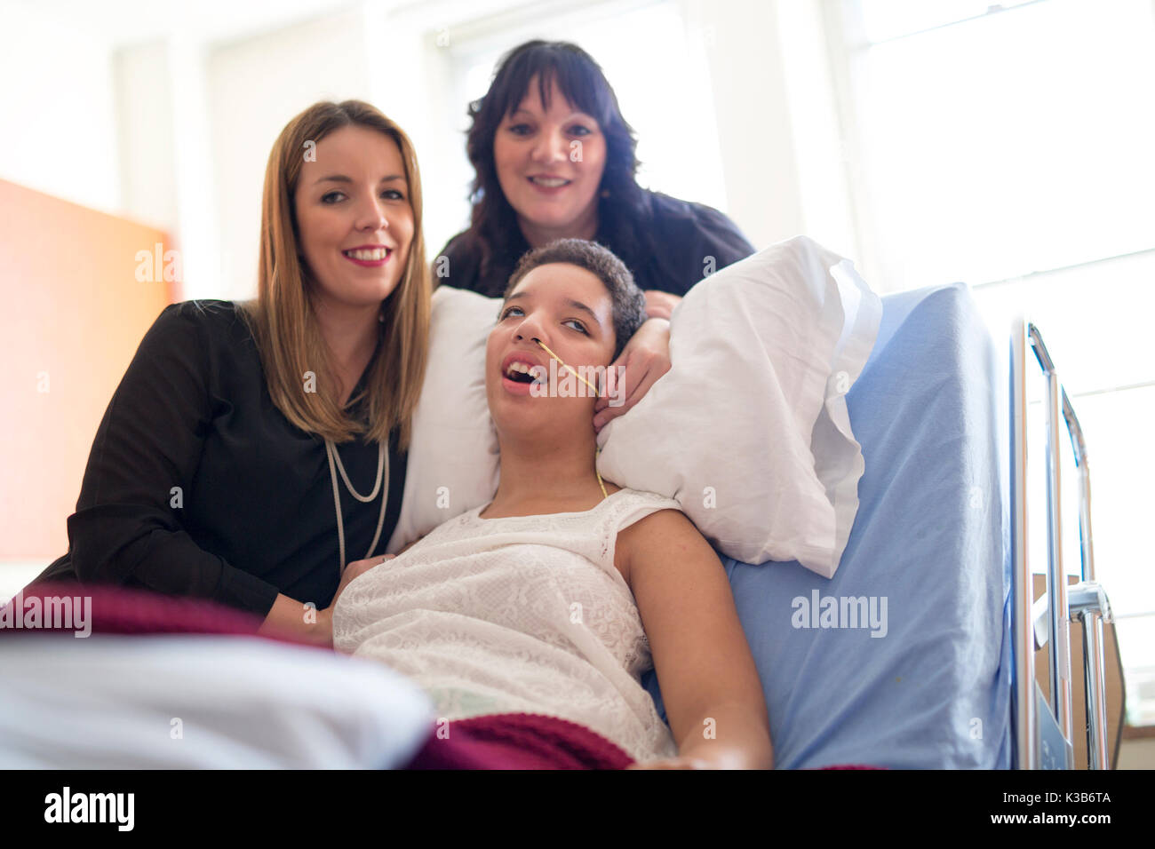 Sick patient lying on bed in hospital for medical background Stock ...