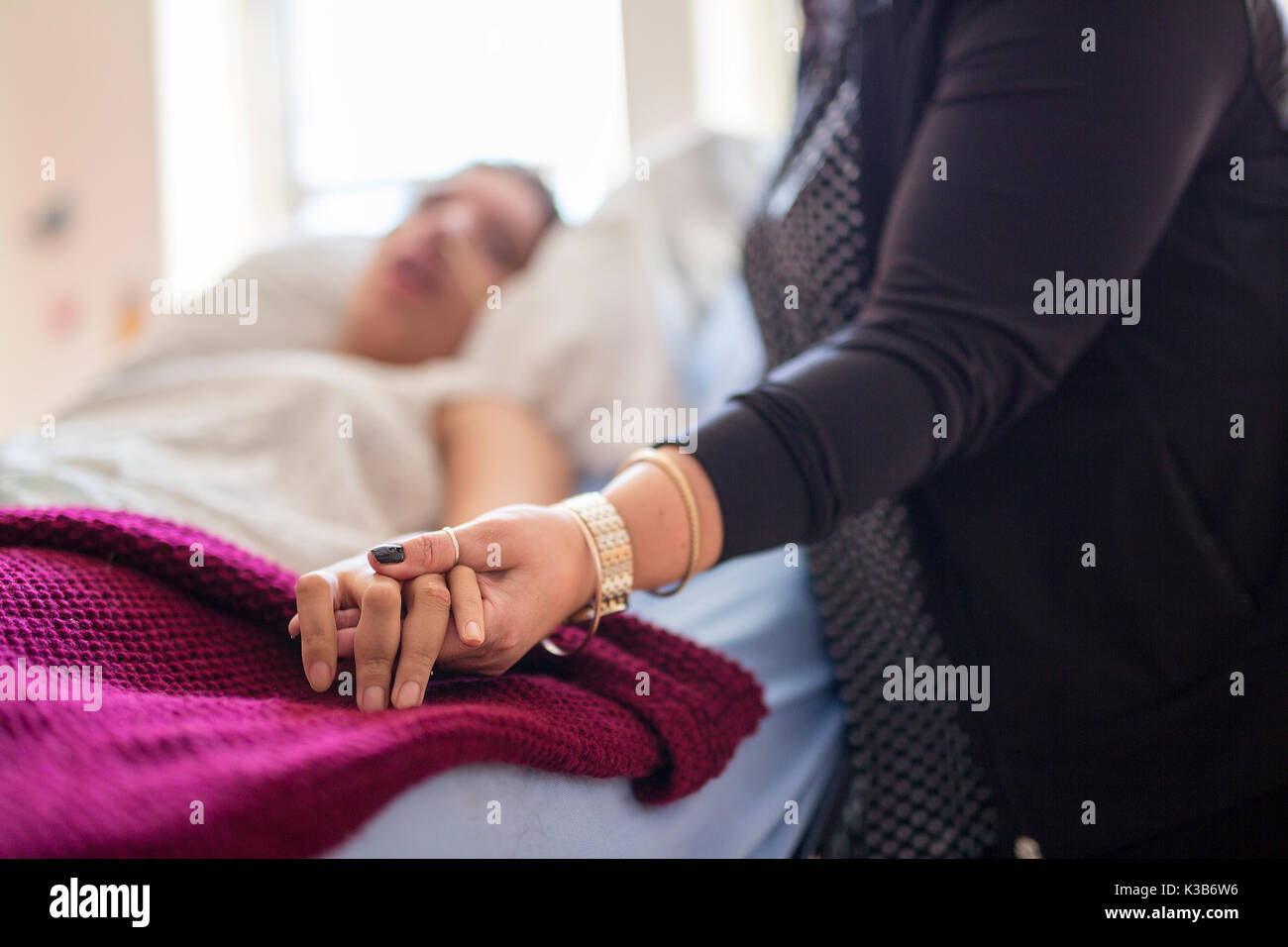 Sick patient lying on bed in hospital for medical background Stock ...