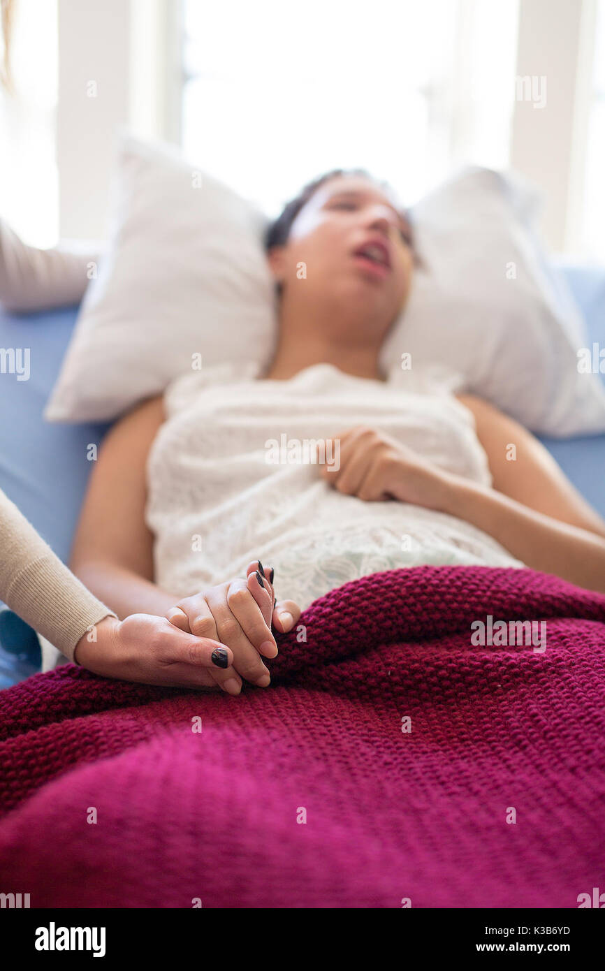 Sick patient lying on bed in hospital for medical background Stock ...
