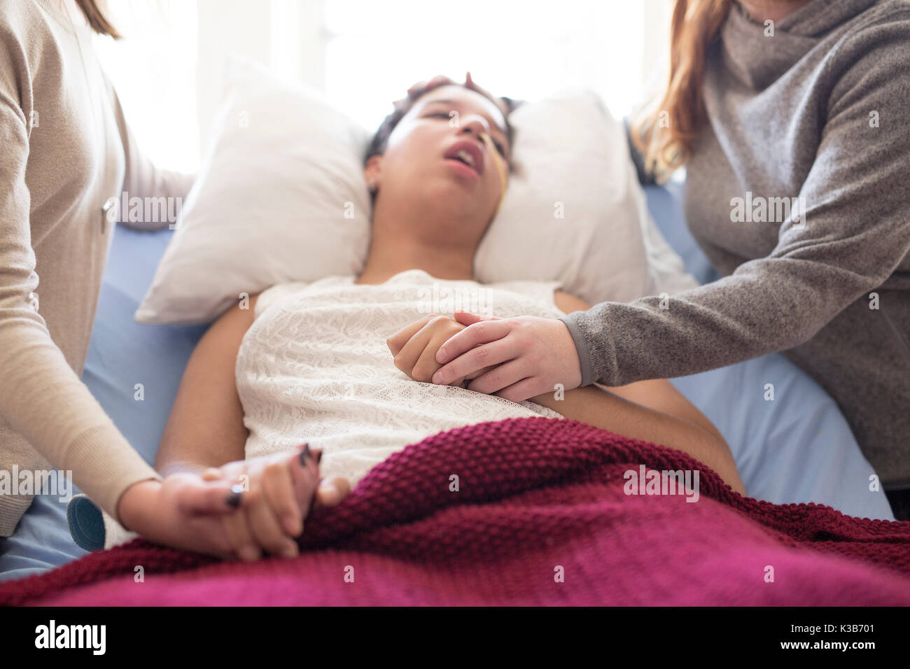 Sick patient lying on bed in hospital for medical background Stock ...