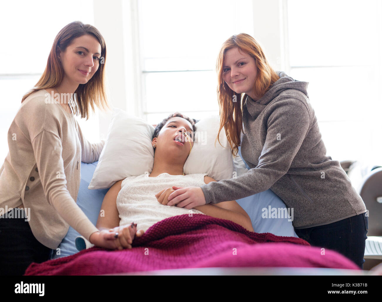 Sick patient lying on bed in hospital for medical background Stock ...