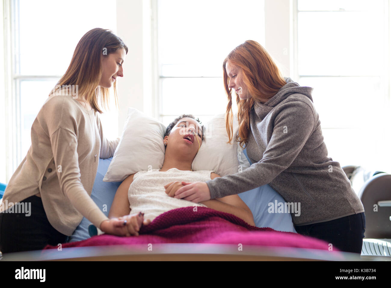 Sick patient lying on bed in hospital for medical background Stock ...