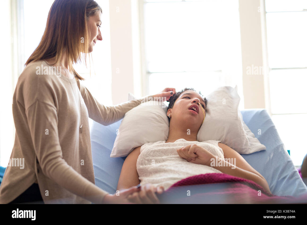 Sick patient lying on bed in hospital for medical background Stock ...