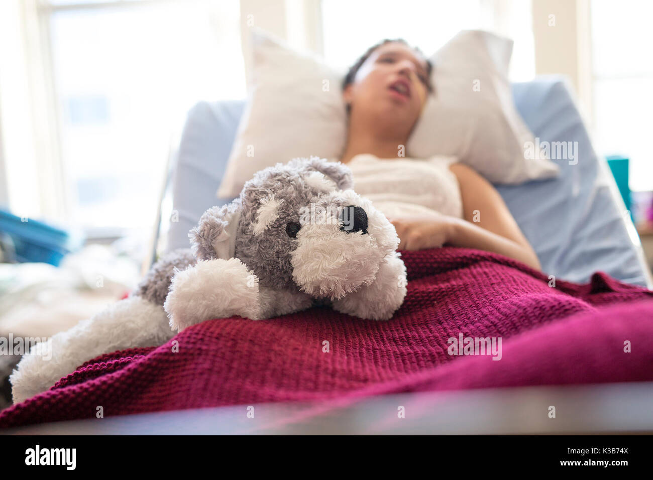 Sick patient lying on bed in hospital for medical background Stock ...