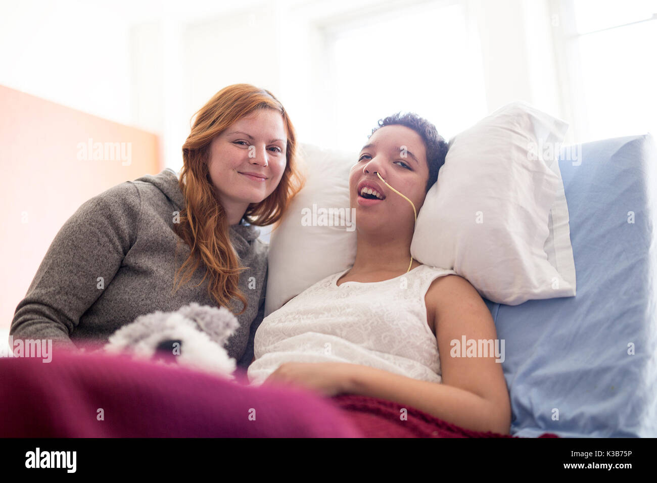 Sick patient lying on bed in hospital for medical background Stock ...