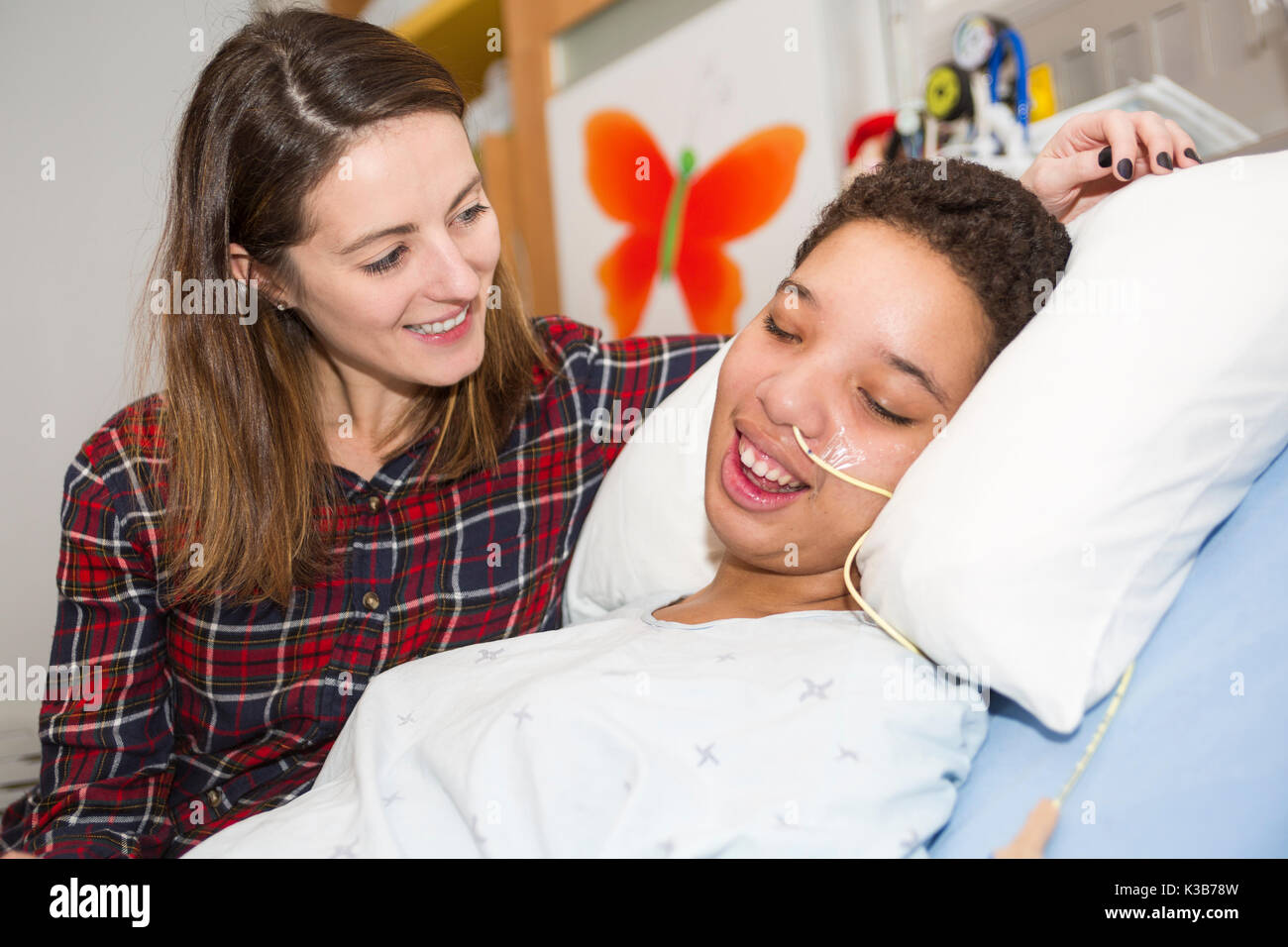 Sick patient lying on bed in hospital for medical background Stock ...