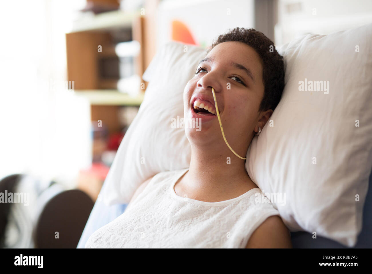 Sick patient lying on bed in hospital for medical background Stock ...