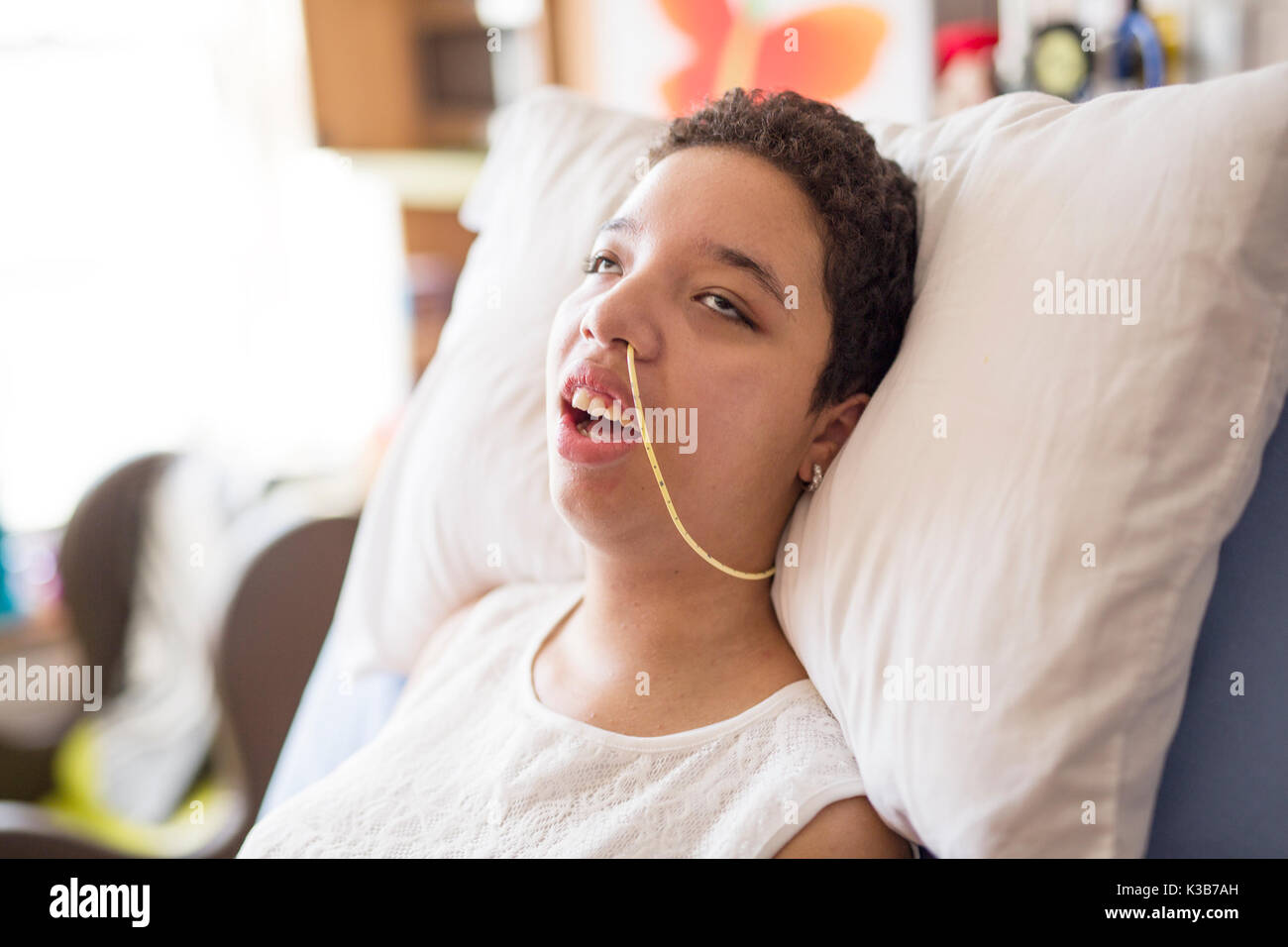 Sick patient lying on bed in hospital for medical background Stock ...