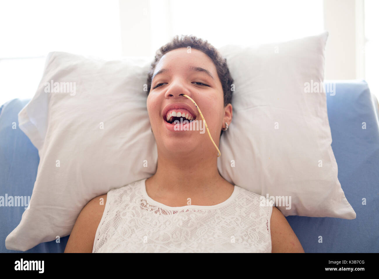 Sick patient lying on bed in hospital for medical background Stock ...