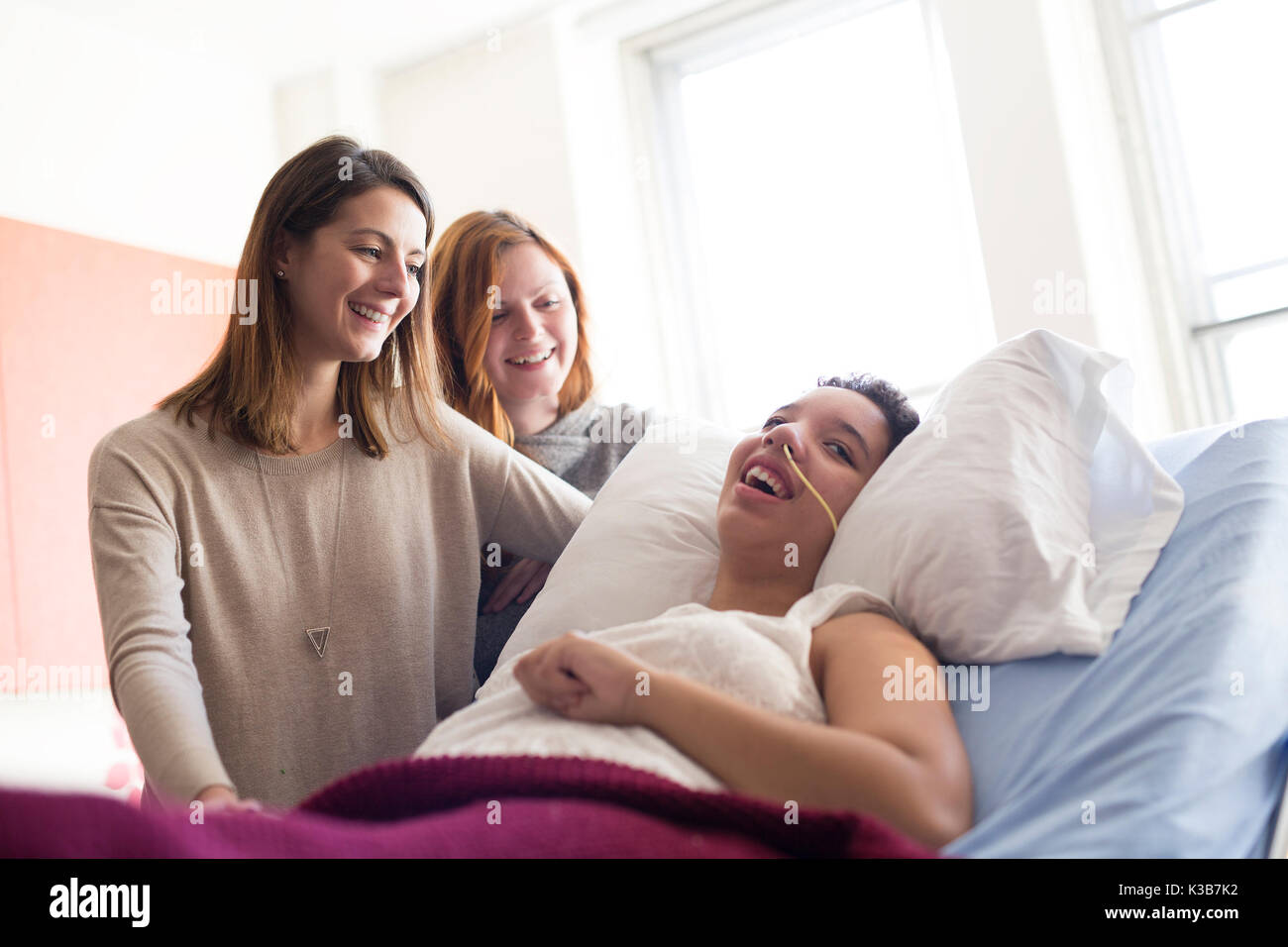 Sick patient lying on bed in hospital for medical background Stock ...