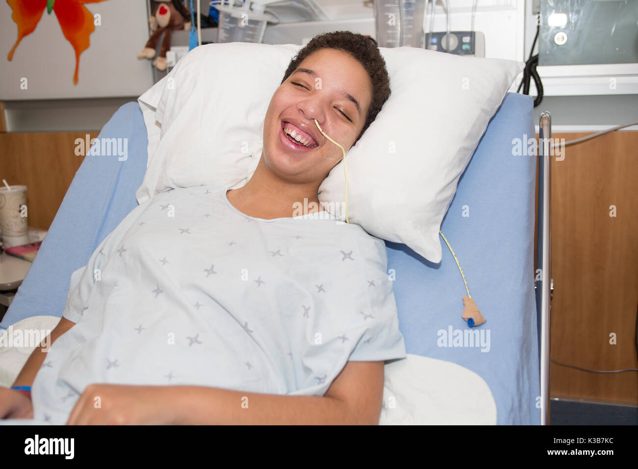 Sick patient lying on bed in hospital for medical background Stock ...