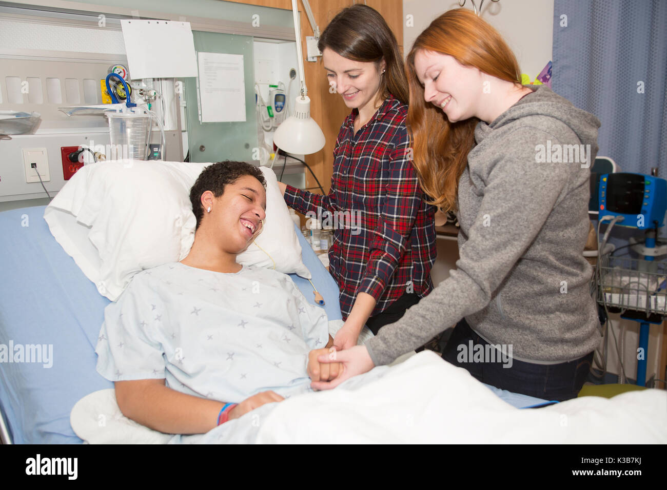 Sick patient lying on bed in hospital for medical background Stock ...
