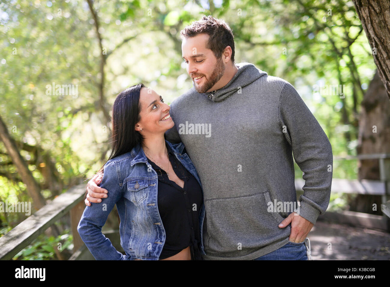 Nice couple having good time in the forest Stock Photo - Alamy